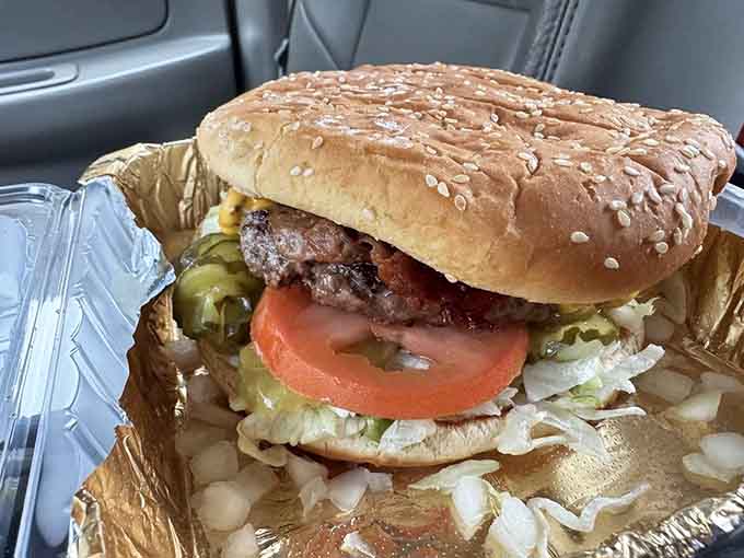 This monster creation proves that sometimes more is more, especially when it comes to stacked patties and melted cheese.