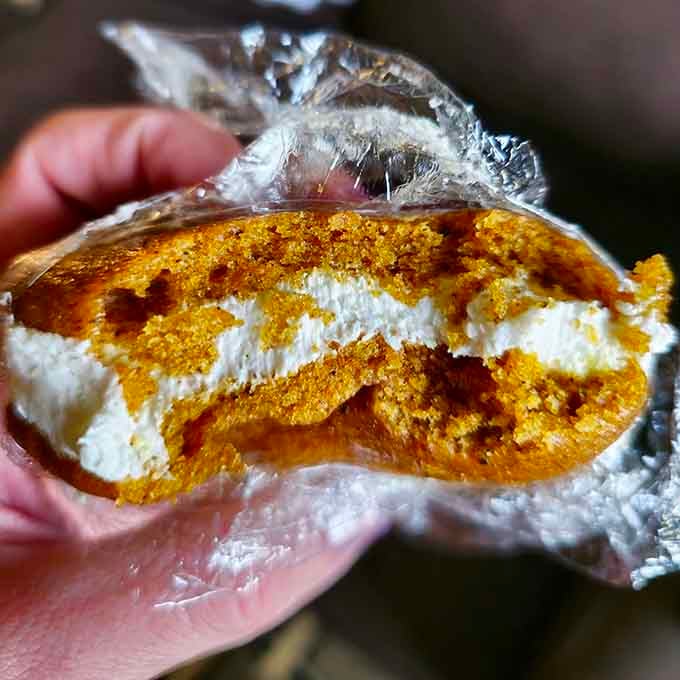 Golden pumpkin cake meets fluffy cream filling in what might be autumn's greatest achievement since flannel shirts.