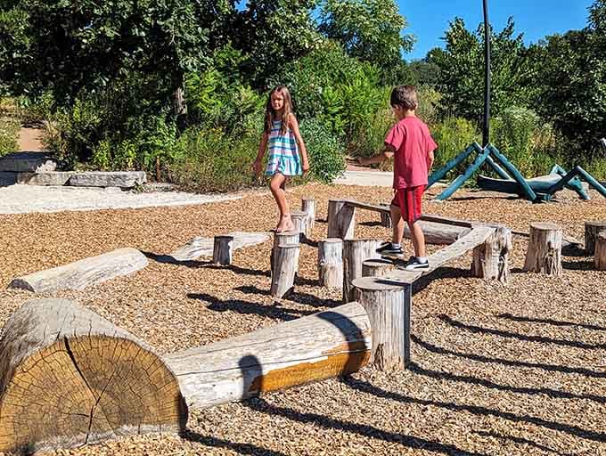 Log obstacle courses turn balance beams into adventures, challenging kids to navigate nature's own playground equipment brilliantly.