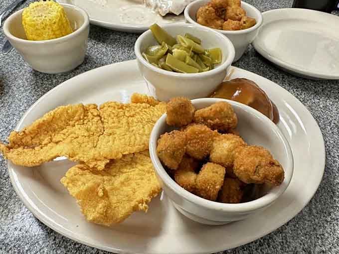 That golden fried catfish is so perfectly crispy, you can practically hear it crunching just by looking at it.