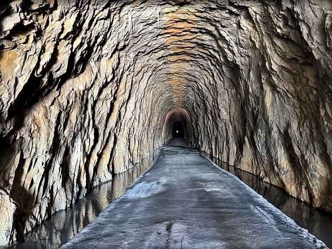 This view stretches nearly a mile through solid rock, proving that sometimes the journey really is the destination itself.