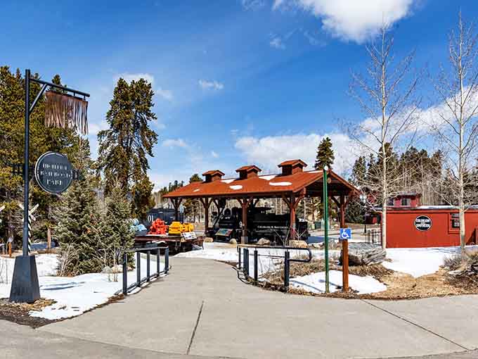 The covered pavilion shelters historic equipment from Colorado weather, because even retired trains deserve a proper roof overhead.