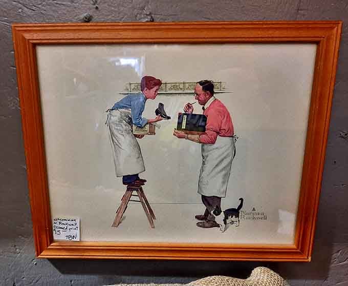 Norman Rockwell's gentle humor captured in a frame, reminding us when shopkeepers knew every customer's name and story.