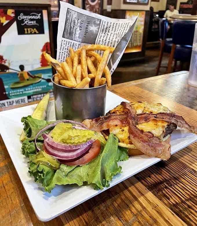 The Charleston Burger sprawls across its plate like it owns the place, which honestly, it kind of does at this point.