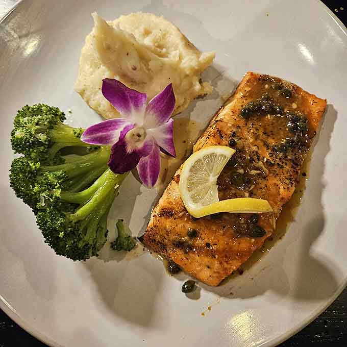 Golden salmon with capers and lemon proves that sometimes the simplest preparations create the most memorable meals on your plate.