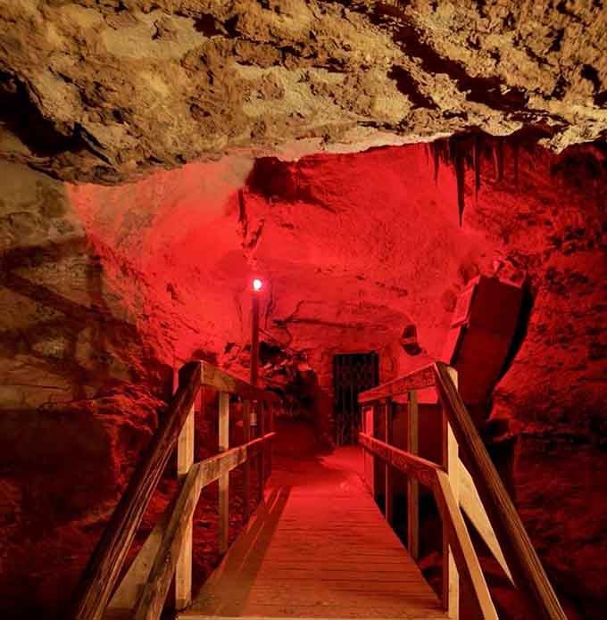 That dramatic red lighting transforms the cave into something between a concert venue and a dragon's lair.