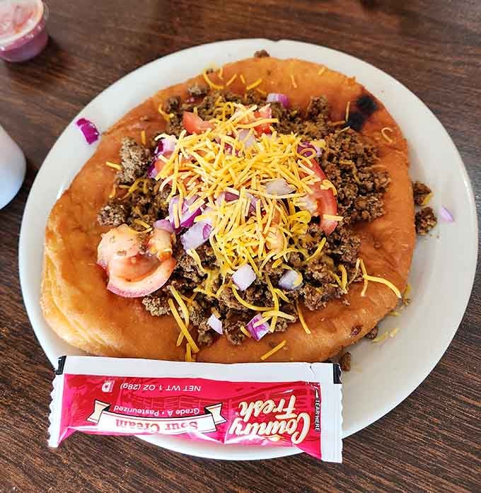 Fry bread tacos topped with seasoned beef and cheese represent comfort food that transcends any single culinary tradition beautifully.