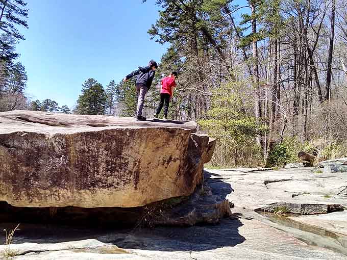 That flat granite formation is basically nature's invitation to sit, stay, and contemplate your life choices.
