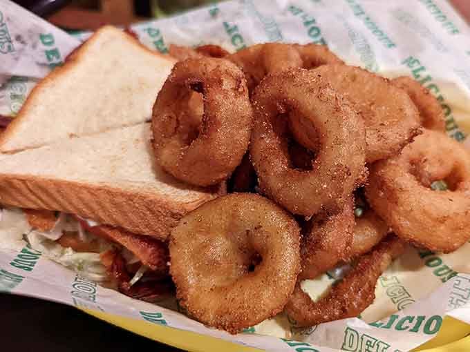 Golden onion rings piled high enough to make you forget every diet you've ever attempted or considered.