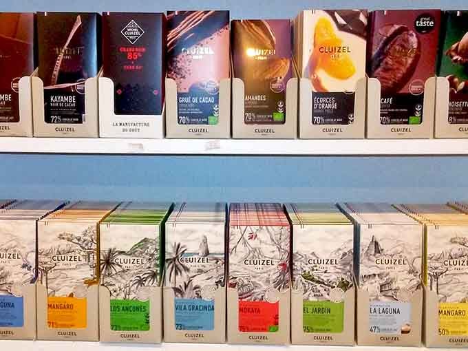 Premium chocolate bars lined up like edible passports, each one offering a first-class ticket to flavor destinations worldwide.