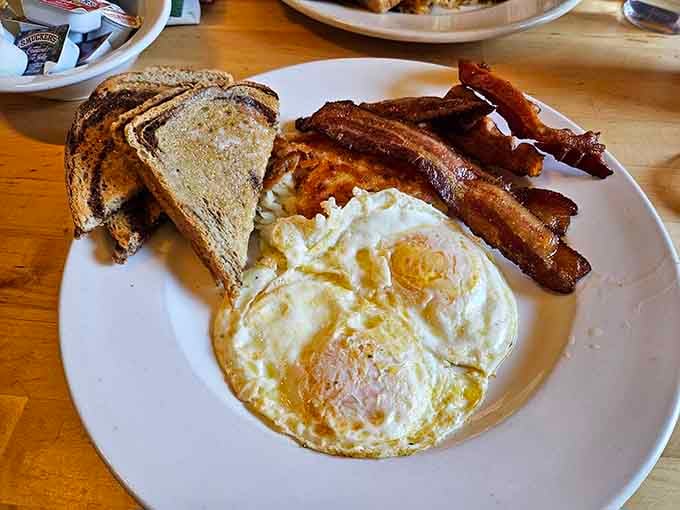 Breakfast done right: eggs, bacon, and toast that'll fuel your day better than any fancy espresso drink.