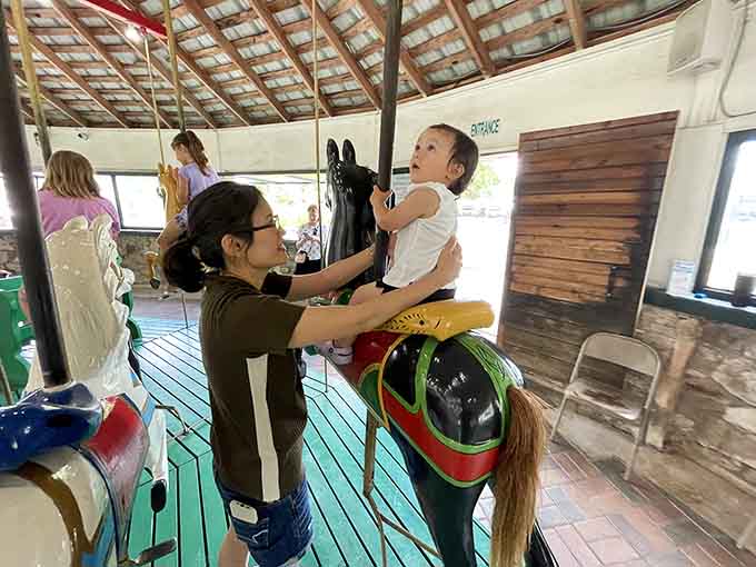 Helping tiny humans onto wooden horses: the universal language of love spoken across every generation.