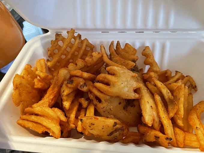 Waffle fries with that distinctive crinkle cut prove even the sides deserve your full attention here.