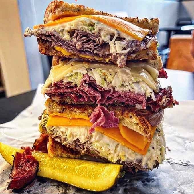 This towering monument to sandwich engineering should probably come with its own structural support team and liability waiver.