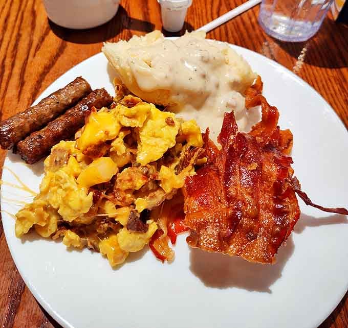 Biscuits drowning in sausage gravy next to crispy bacon is basically what heaven serves for breakfast every morning.