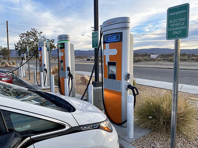 Modern amenities meet desert charm with electric vehicle charging stations for the eco-conscious road tripper.
