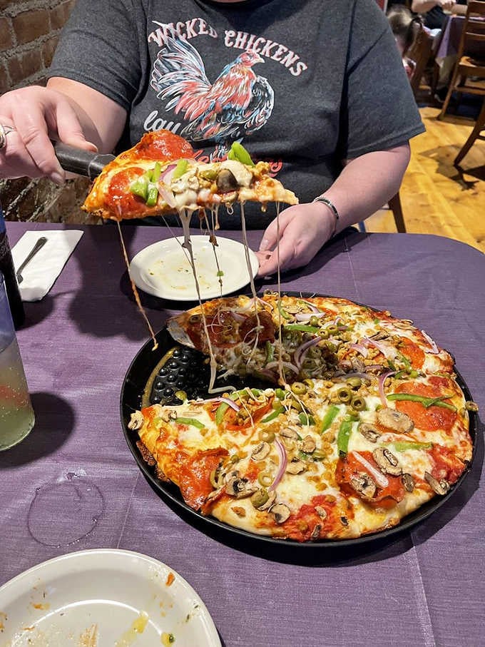 When your pizza needs a forklift and comes with enough toppings to feed a small village of werewolves.