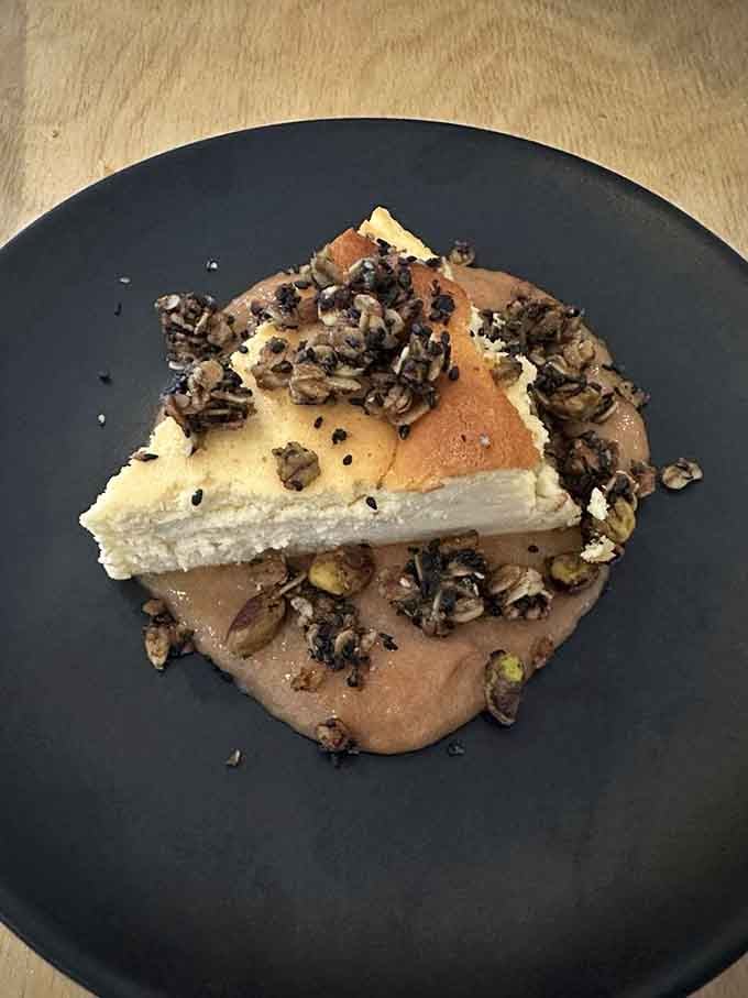 Basque cheesecake at Farm Club arrives with candied nuts, because sometimes dessert needs a little extra personality and crunch.