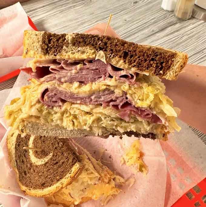 The Reuben on marble rye, where corned beef, sauerkraut, and Swiss cheese create deli magic worth celebrating.