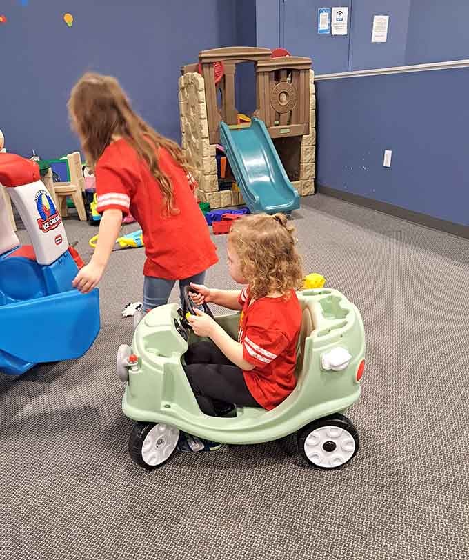 Tiny drivers navigating their plastic chariots with more confidence than most people show merging onto the highway.