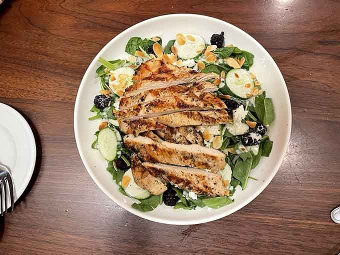 Grilled chicken transforms a simple salad into something worth putting down your phone to enjoy.