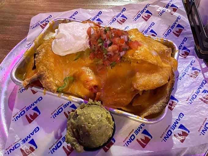 Nachos piled high with cheese, sour cream, and guacamole prove that sometimes excess is exactly what the doctor ordered.
