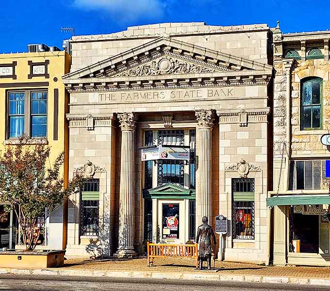 Classical columns frame this former bank building, now preserving stories instead of deposits and withdrawal slips.