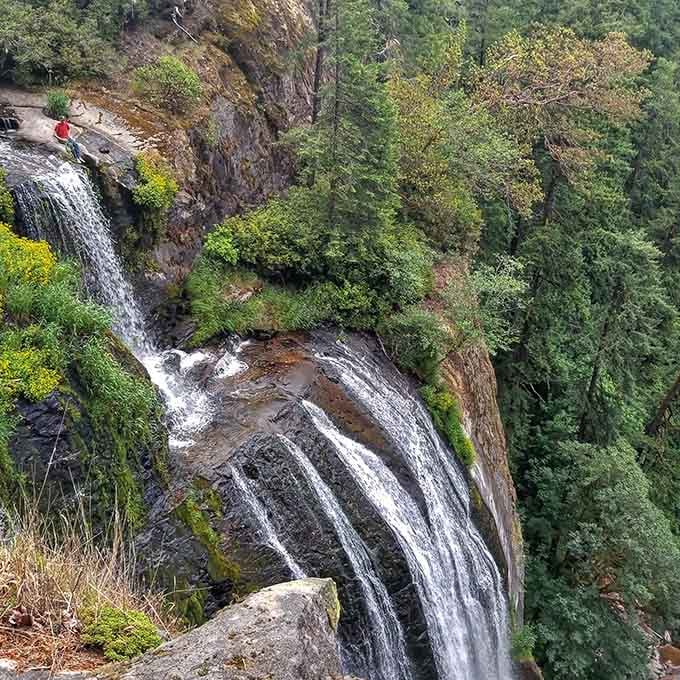 Water tumbles over ancient rock formations, creating nature's own fountain show that never needs a ticket purchase.
