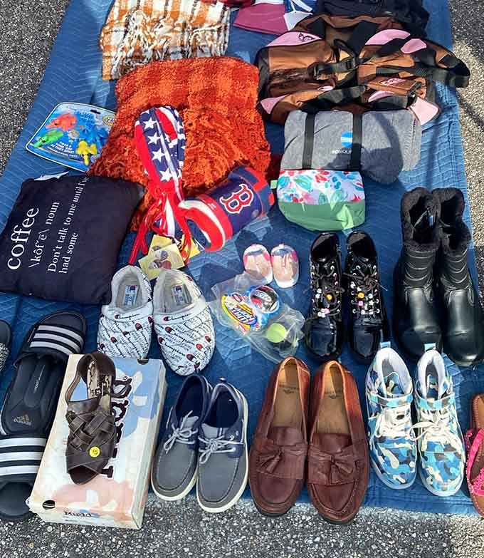 Shoes arranged on blankets like a footwear buffet, from practical sneakers to fancy loafers that have stories to tell.