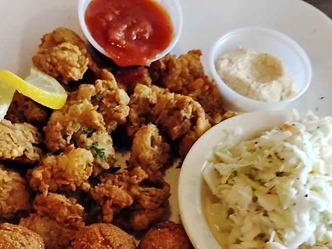 Crispy fried oysters piled high with coleslaw show why this inland spot earned its seafood reputation.