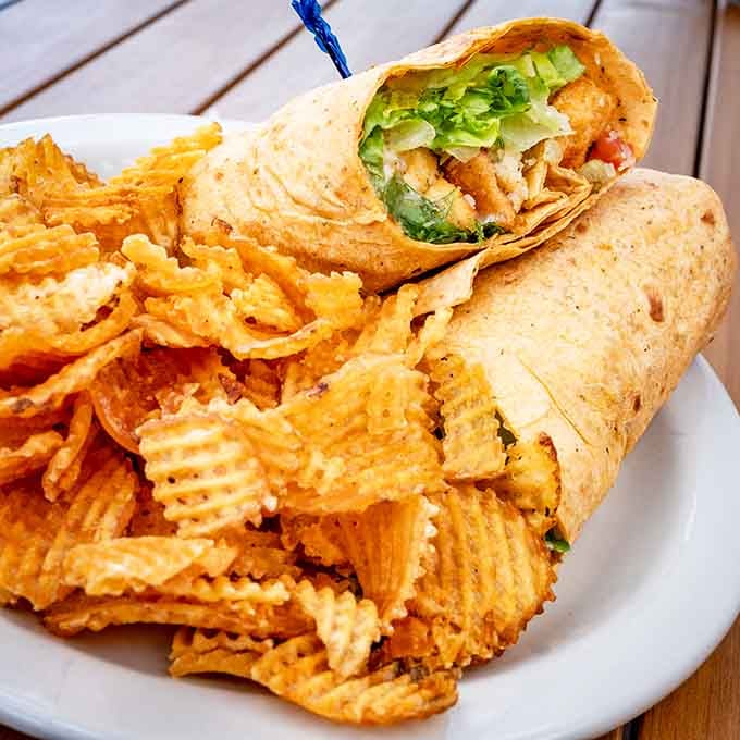 The Buffalo Bleu Wrap arrives stuffed so full, it's practically bursting with flavor and good intentions.