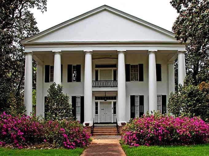 Magnolia Grove stands there with its columns and azaleas like it's auditioning for every Southern movie ever made, and honestly, it's got the part.