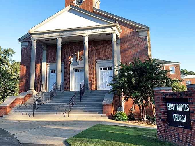 First Baptist Church stands proud with columns that say "we've been here awhile and we're staying, thank you."