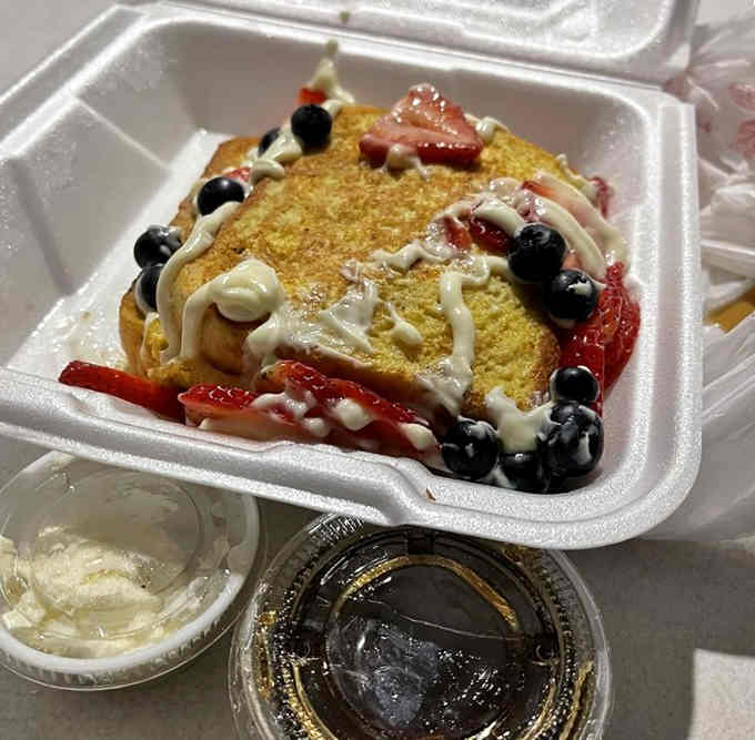 Stuffed French toast topped with berries and cream, because sometimes breakfast needs to feel like dessert first.