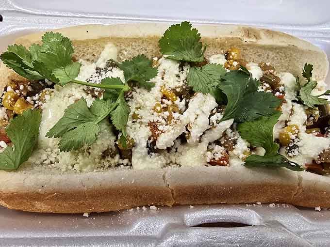 Cilantro, crumbled cheese, and a hot dog that's clearly been hanging out with some interesting culinary influences.