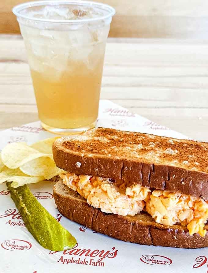A pimento cheese sandwich paired with apple cider and chips is the kind of simple lunch that makes you rethink everything.