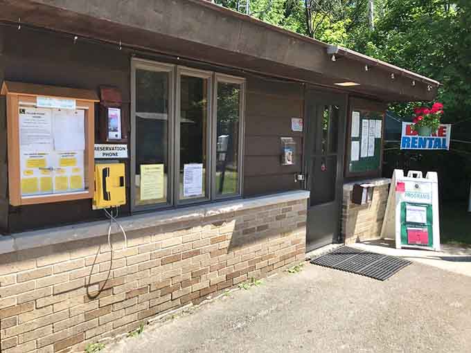 The registration office stands ready to welcome campers, because even paradise needs a check-in desk and friendly staff.