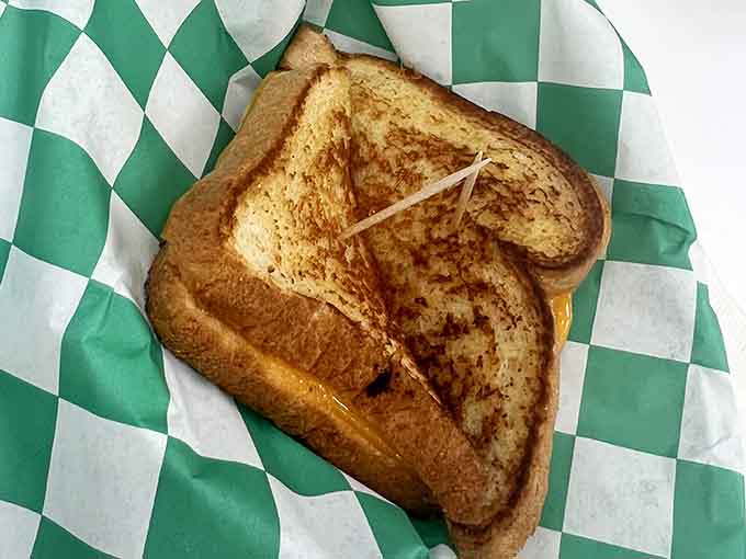 Golden-griddled perfection on checkered paper, the kind of comfort food that never goes out of style.