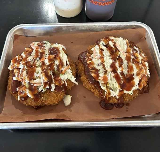 Pork cakes topped with slaw and sauce, because sometimes barbecue needs to get a little fancy and fun.