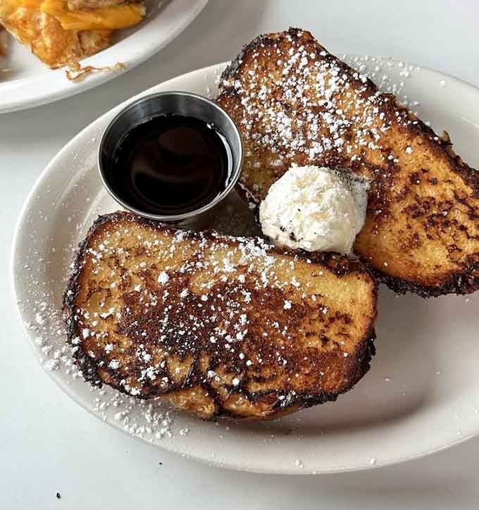 French toast dusted with powdered sugar and served with whipped butter is basically edible happiness on a plate.