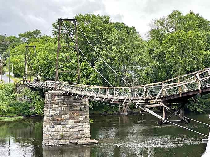 Stone pillars anchor this graceful suspension bridge, proving good engineering never goes out of style completely.
