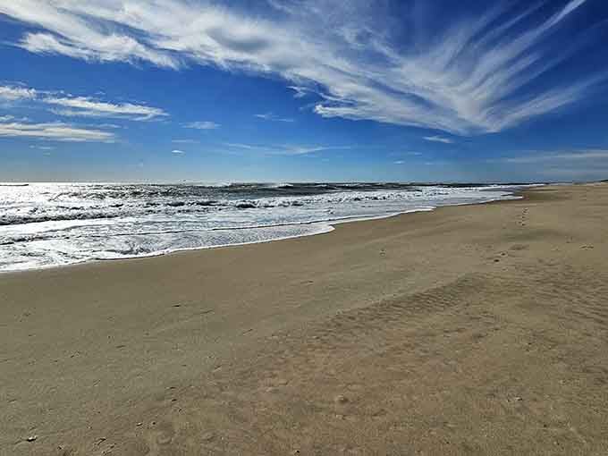 Perfect waves rolling in under dramatic skies, nature's own special effects department working overtime without CGI.