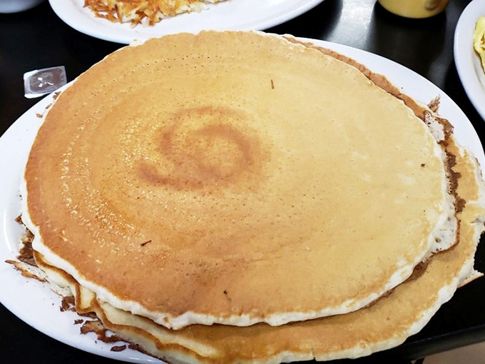 Pancakes stacked tall enough to require structural engineering but light enough to keep you coming back.
