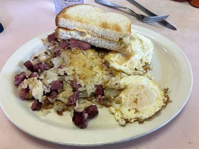 Real corned beef hash with eggs, the kind of hearty breakfast that fuels actual work, not just Instagram posts.