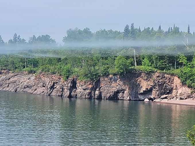 Morning mist rolling over the cliffs adds mystery to an already magical North Shore morning scene.