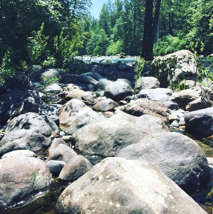 River rocks creating natural rapids that sound better than any white noise machine money can buy.