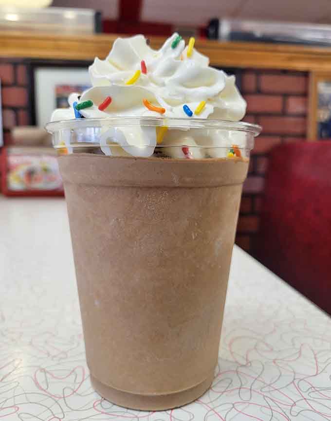 This chocolate shake comes with whipped cream and sprinkles because adults deserve to feel like kids too.