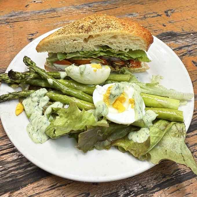 That sandwich and asparagus salad combo looks like springtime decided to throw a party right on your plate.