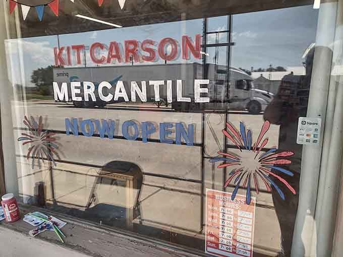 The mercantile window promises treasures inside, because every small town needs its gathering place.