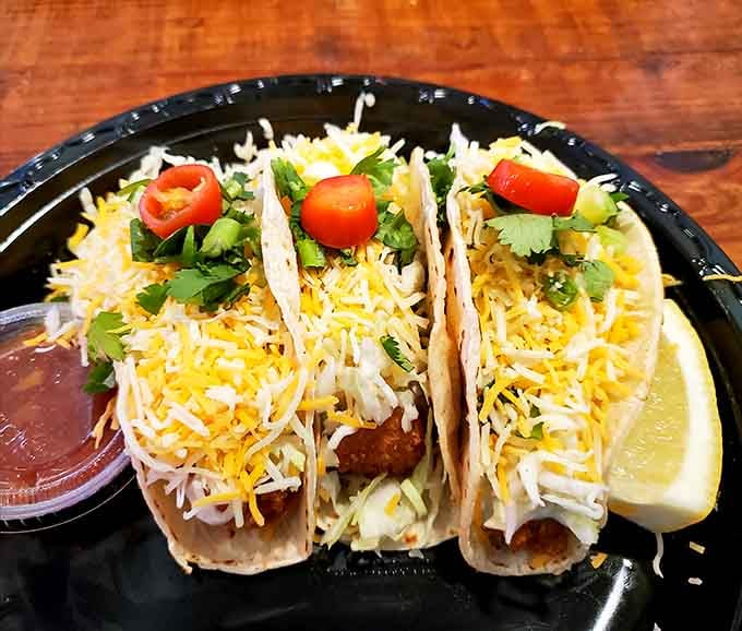 Three fish tacos loaded with all the fixings—because sometimes the best things in life come in threes.